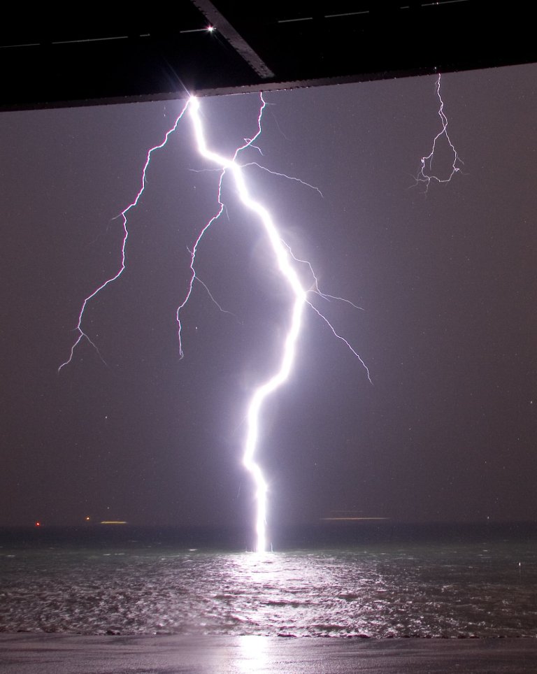 A Lightning Bolt Hits Water, So Close You Can See Its Streamers ...